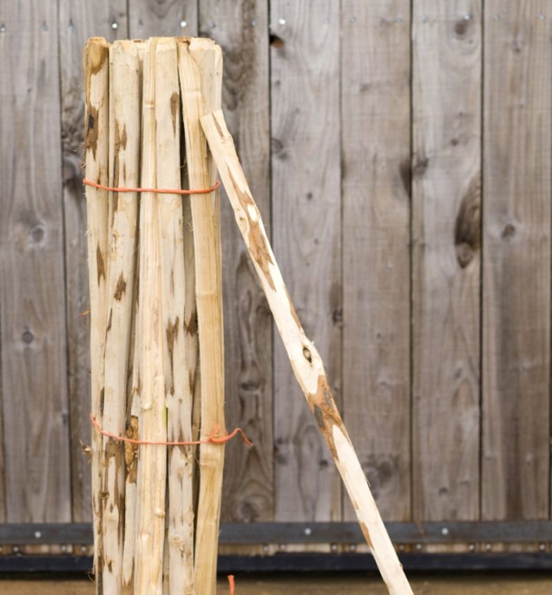 Chestnut poles with a triangular section approximately 2 -3" wide by 4 ...